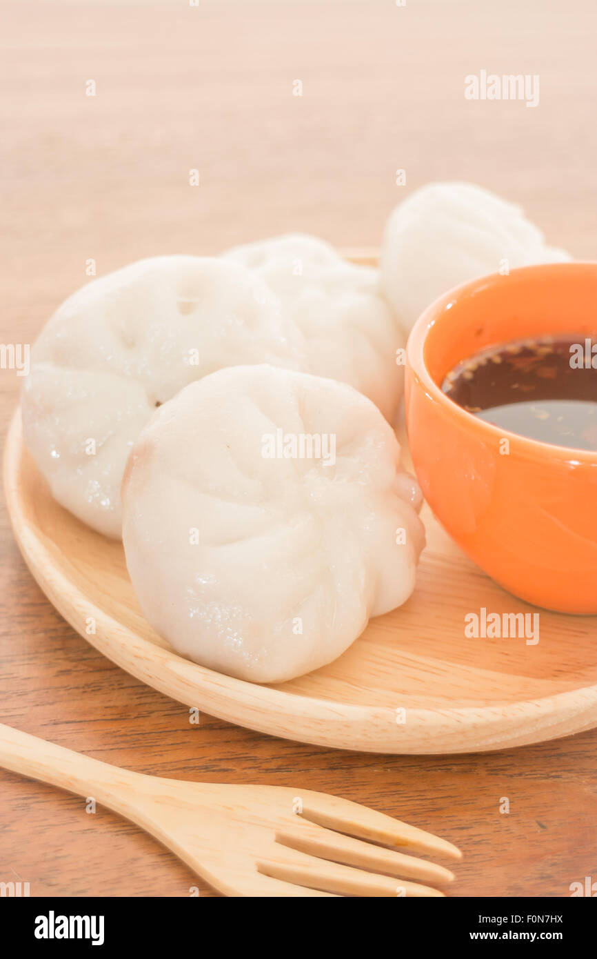 Steamed dumpling stuff on wooden plate, photo Stock Photo - Alamy