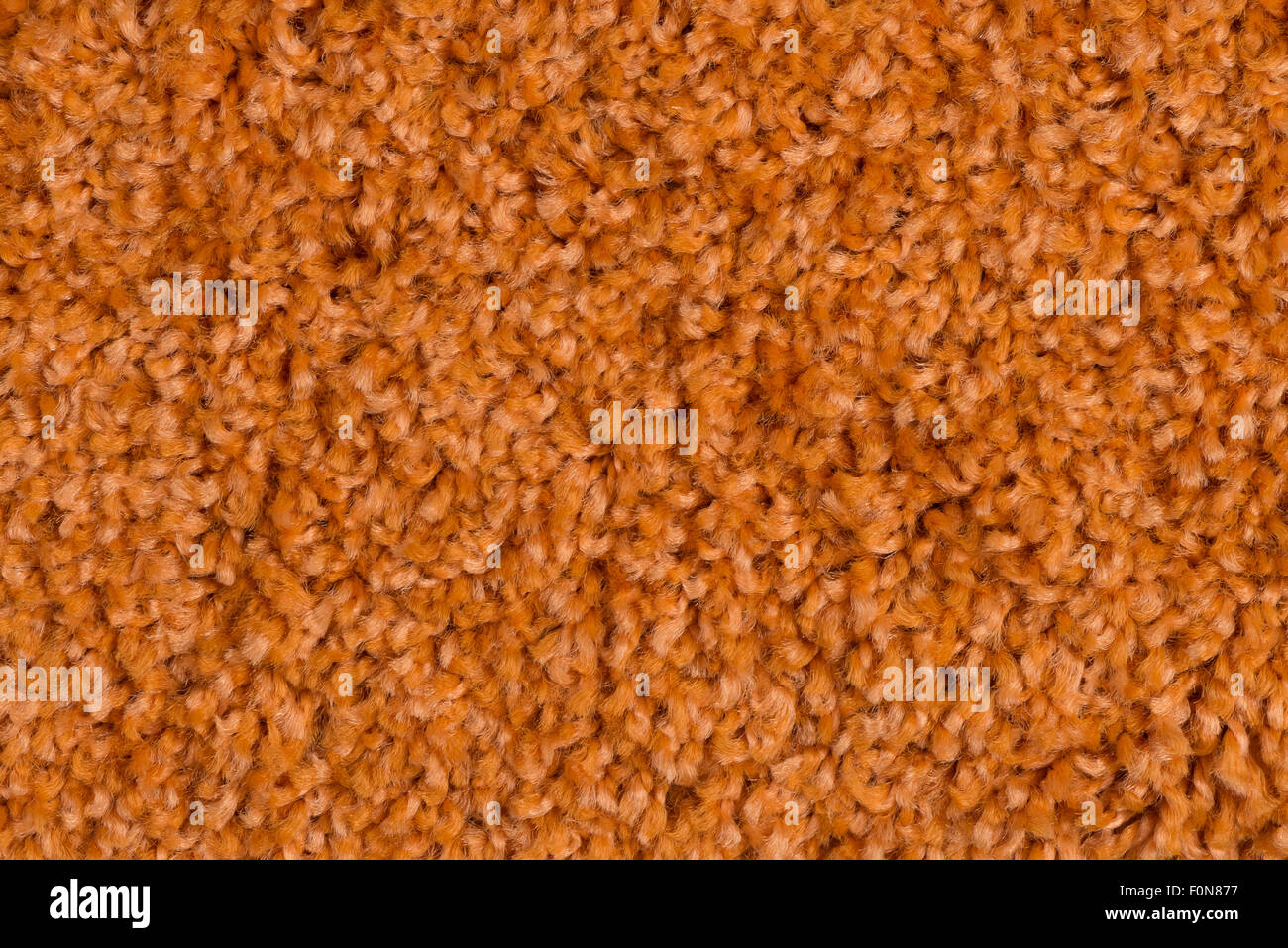 Closeup detail of orange carpet texture background Stock Photo - Alamy