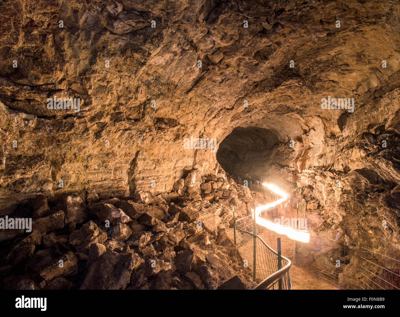 Light trail along designated path inside of caves Stock Photo - Alamy