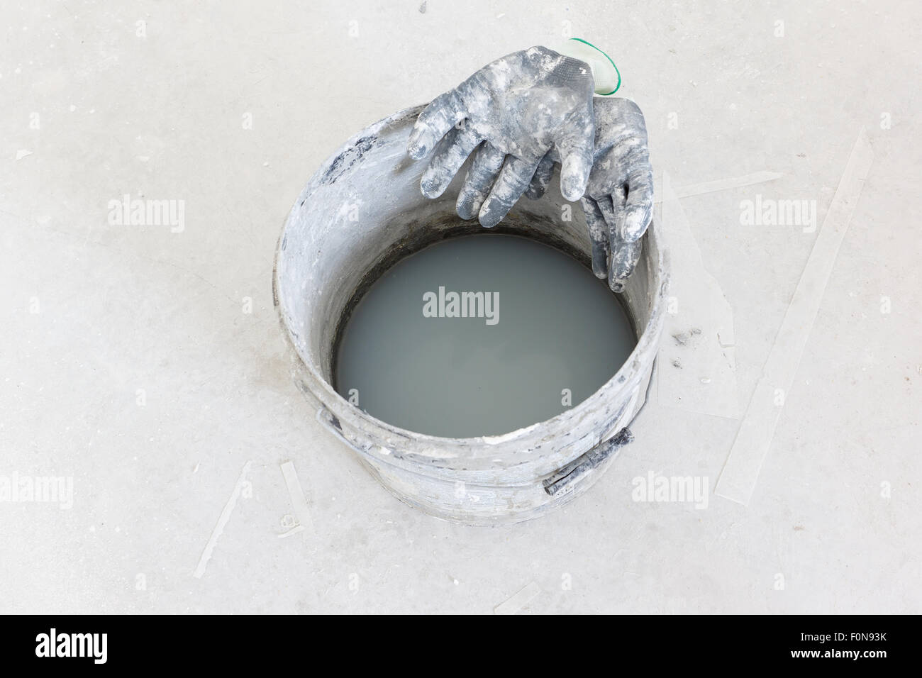 the bucket with dirty water costs indoors where repair was carried out ...