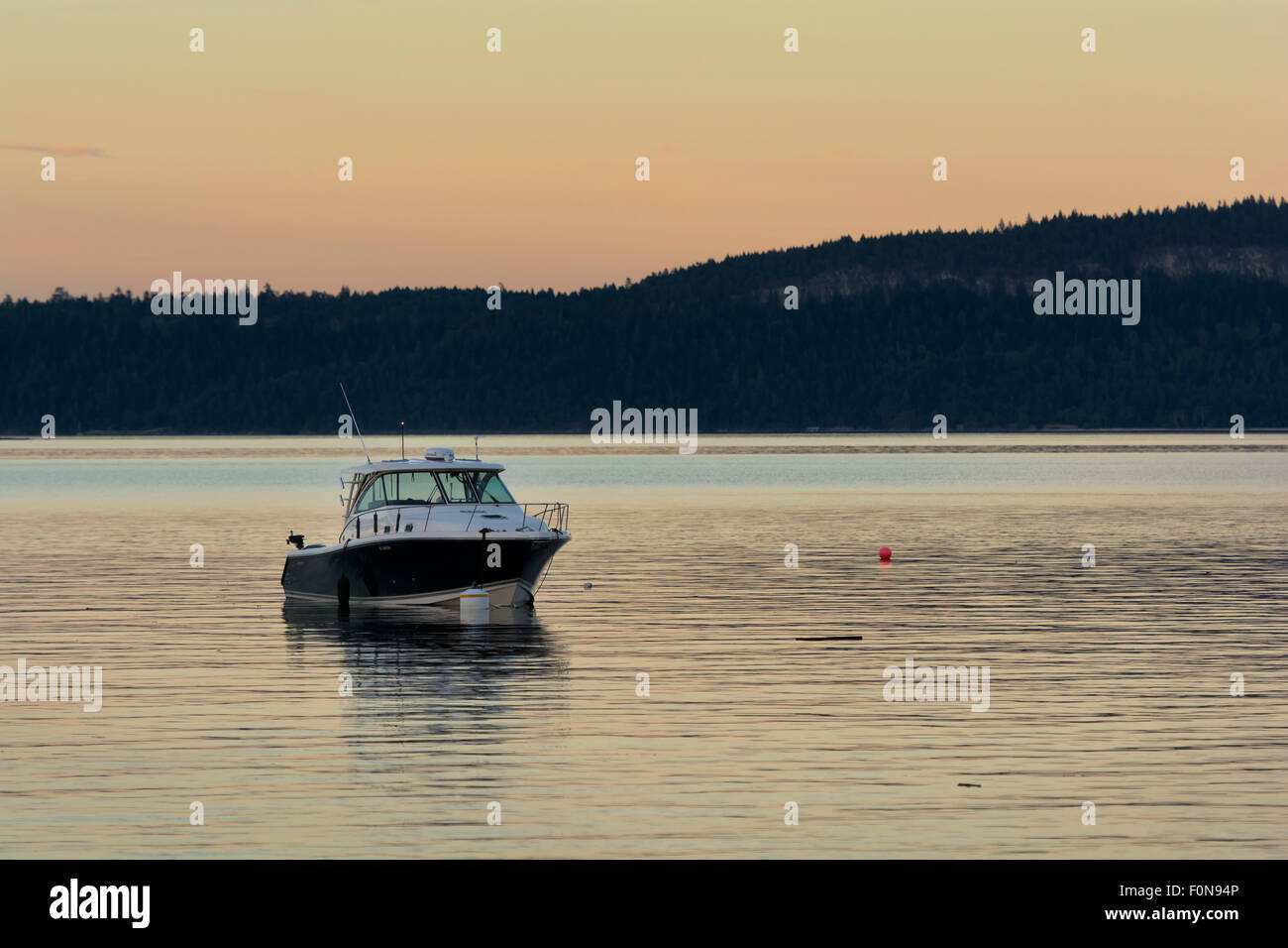 Power boat at sunset Stock Photo - Alamy