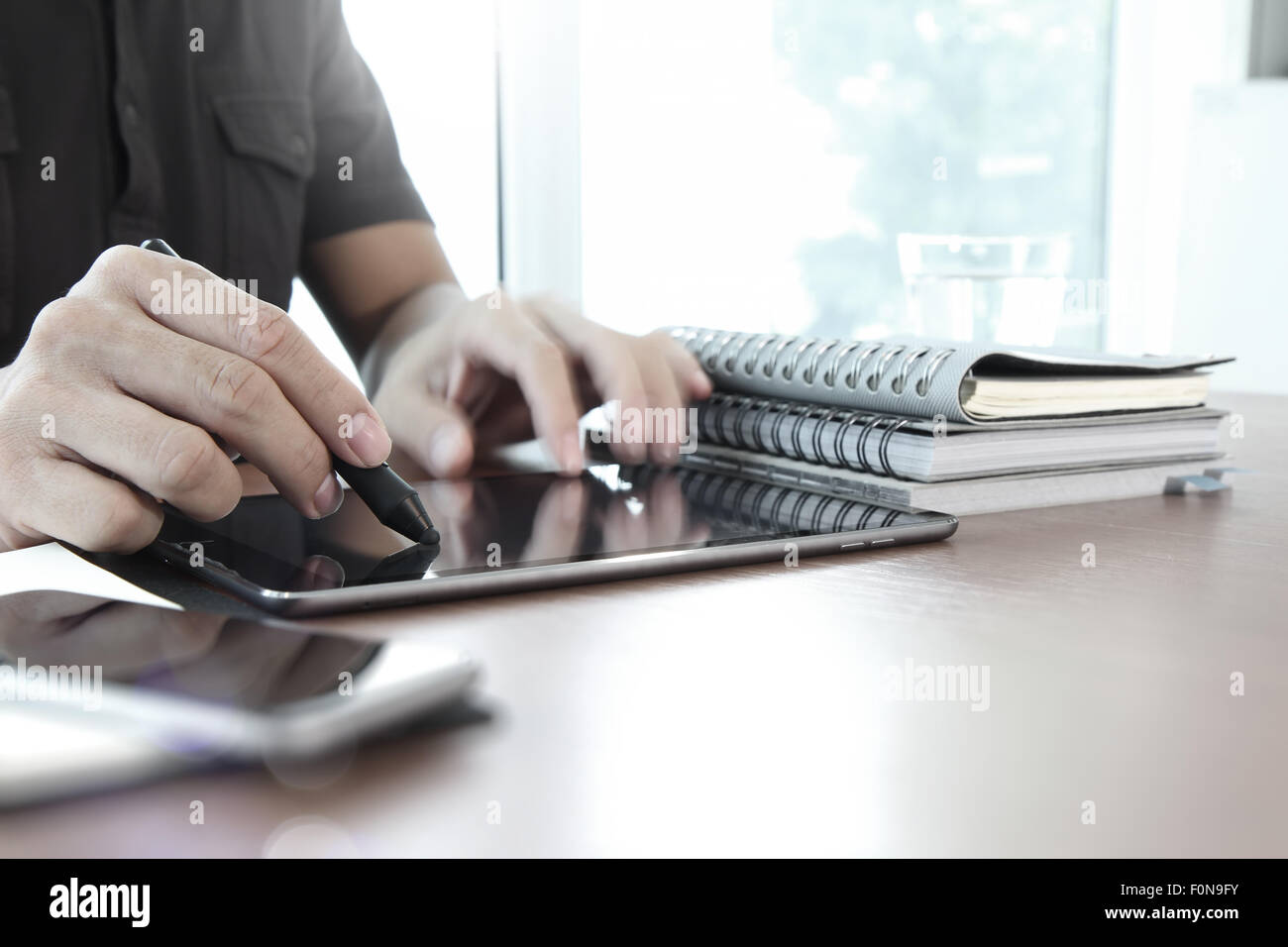 Close up of business man hand working on blank screen laptop computer ...