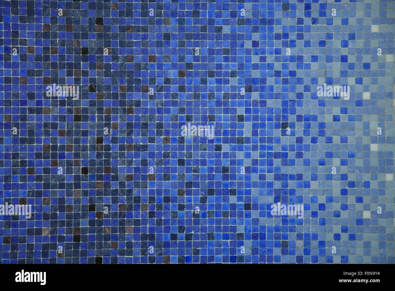 Background of little irregular blue tiles with right side fading to ...