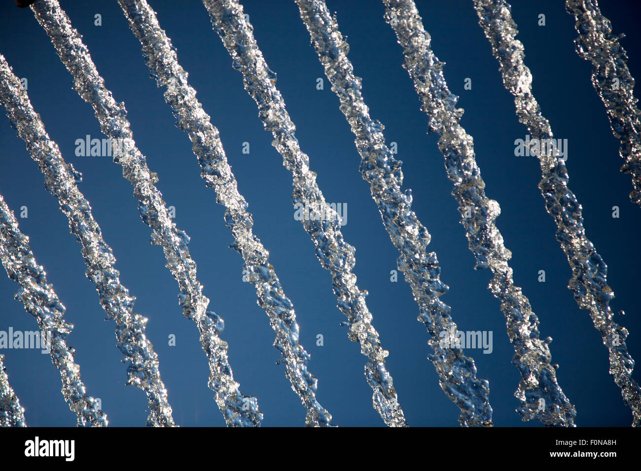 Different water-shoot on a blue background. Shooting with fast speed ...