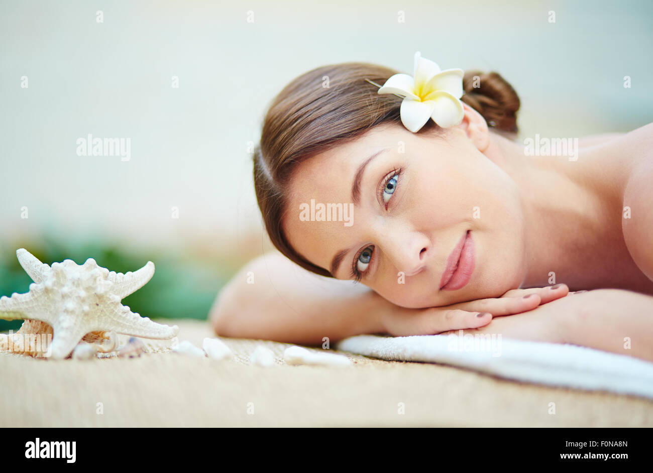 Pretty female face with seashell Stock Photo - Alamy