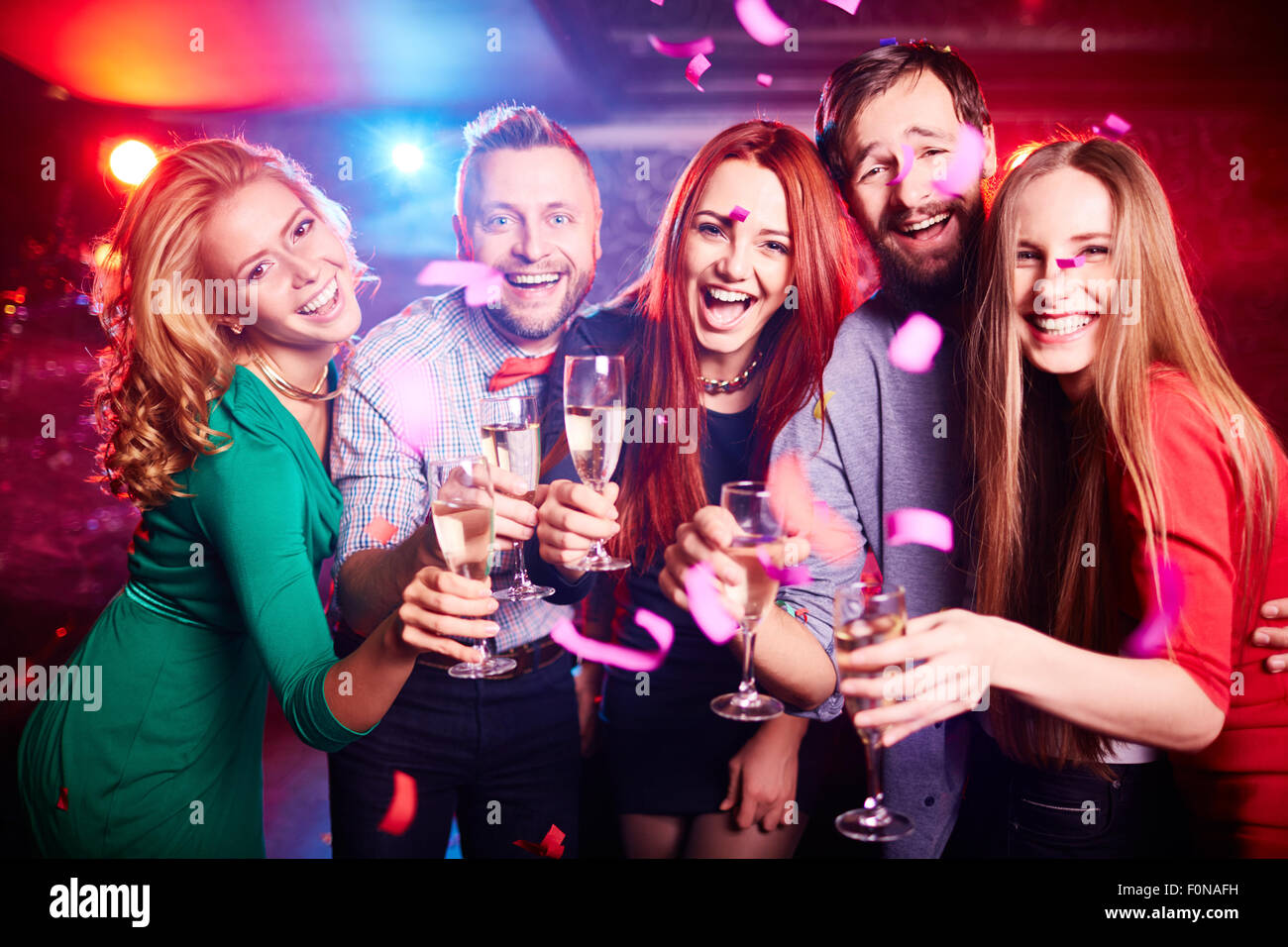 Friends partying at nightclub Stock Photo - Alamy