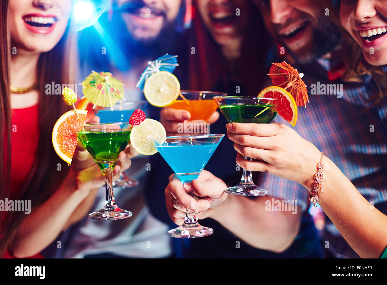 Young people drinking cocktails at nightclub Stock Photo - Alamy