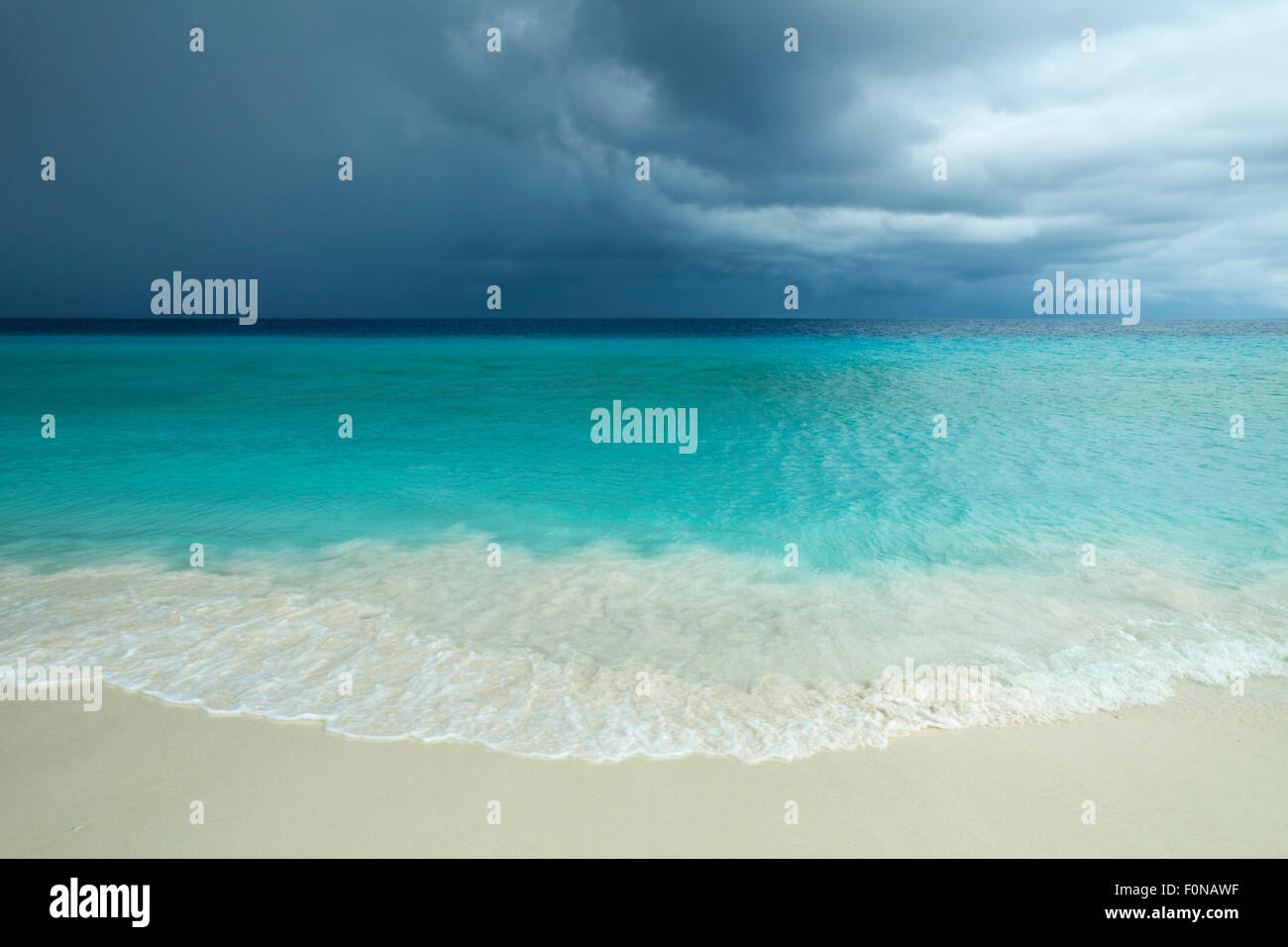 Storm clouds over a tropical beach on Little Curaçao, Netherlands ...