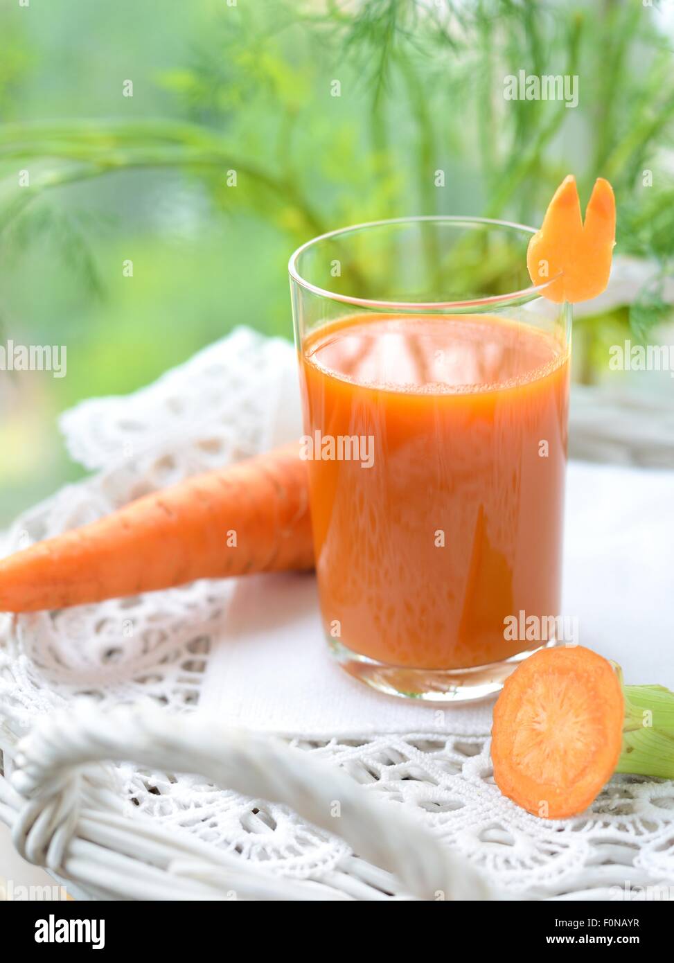Glass of fresh carrot juice Stock Photo - Alamy