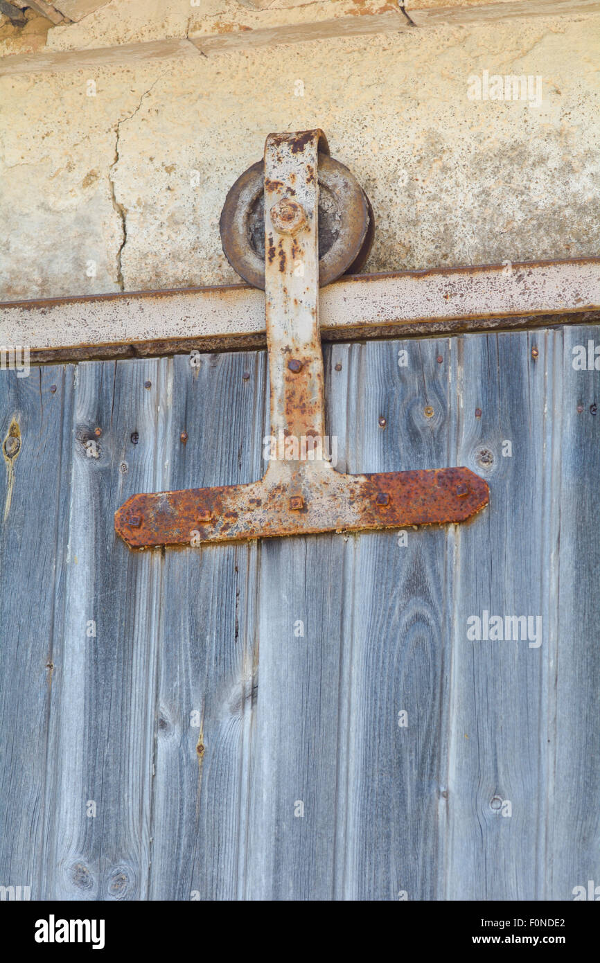Barn sliding door wheel mechanism on farm in Saint Thomas de Conac ...