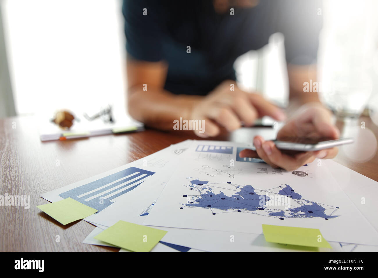 Young creative hand designer man working at office and social network ...