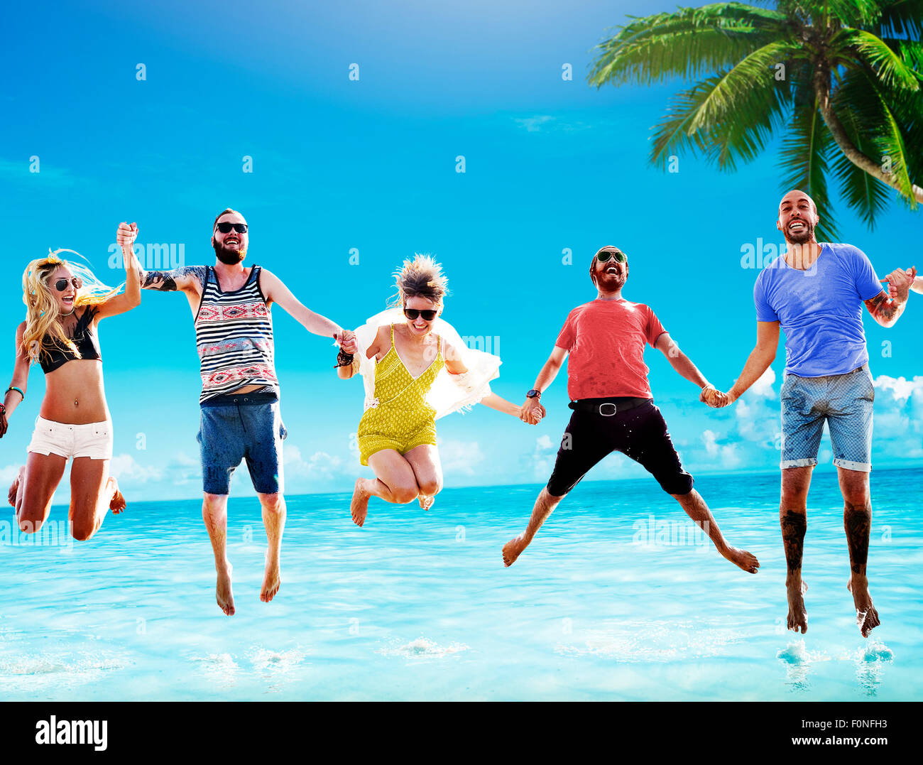 Beach Summer Friends Jumping Happiness Concept Stock Photo - Alamy