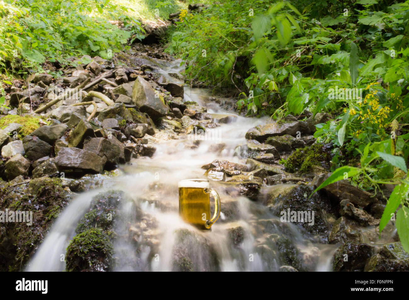 beer cooled in waterfall spring Stock Photo - Alamy