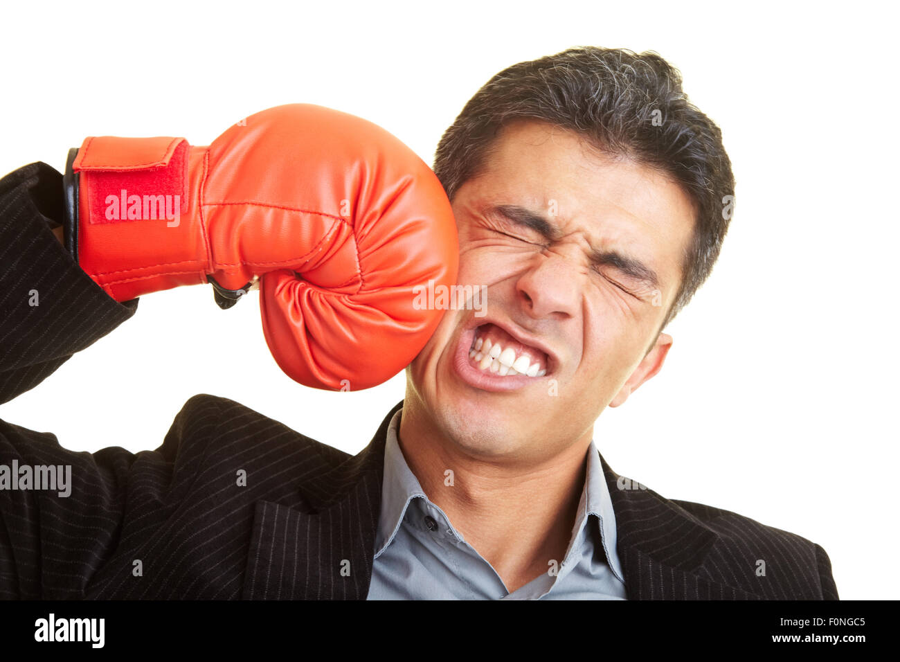 Business man hitting himself with a red boxing glove in the face Stock ...