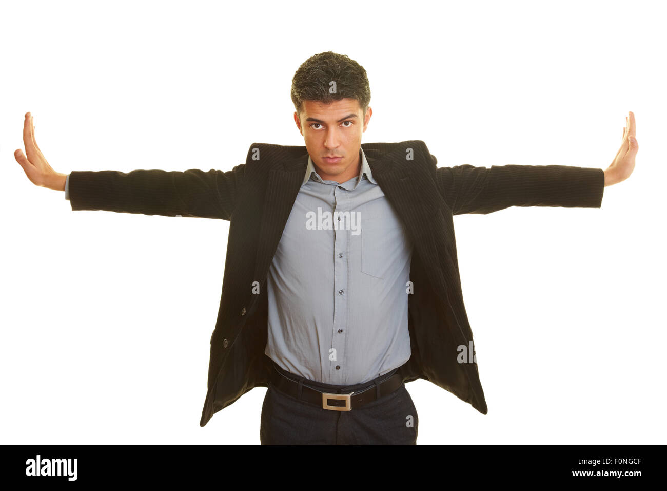 Business man stretching his arms to the side Stock Photo - Alamy