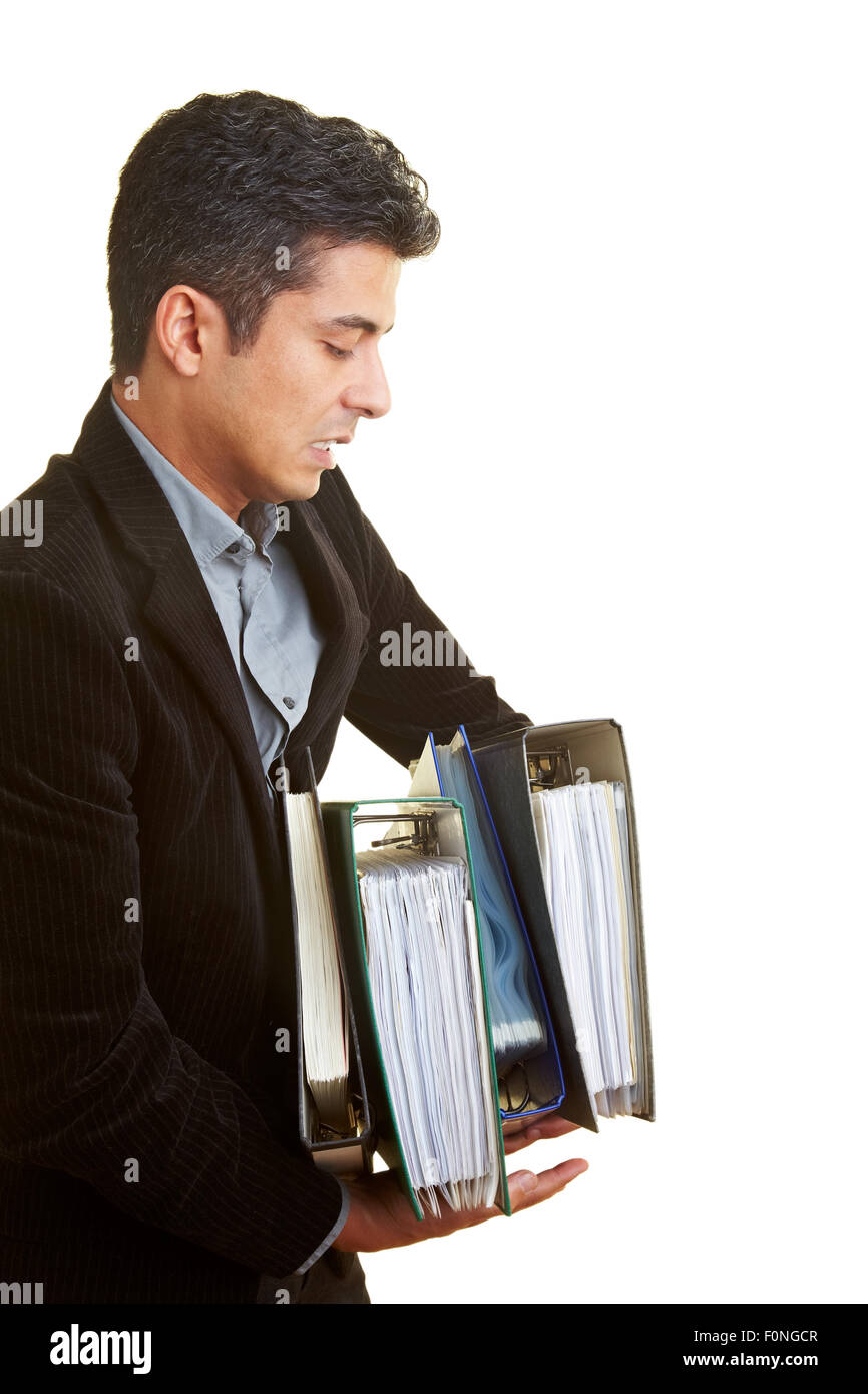 Businessman tries to catch falling files Stock Photo - Alamy
