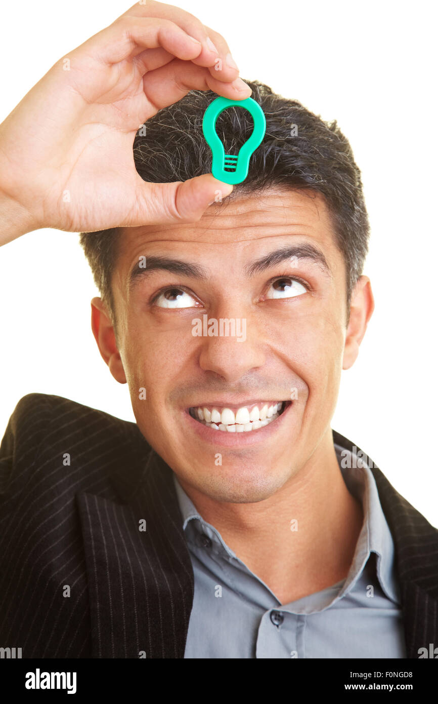 Happy man holding a small light bulb shape over his head Stock Photo ...