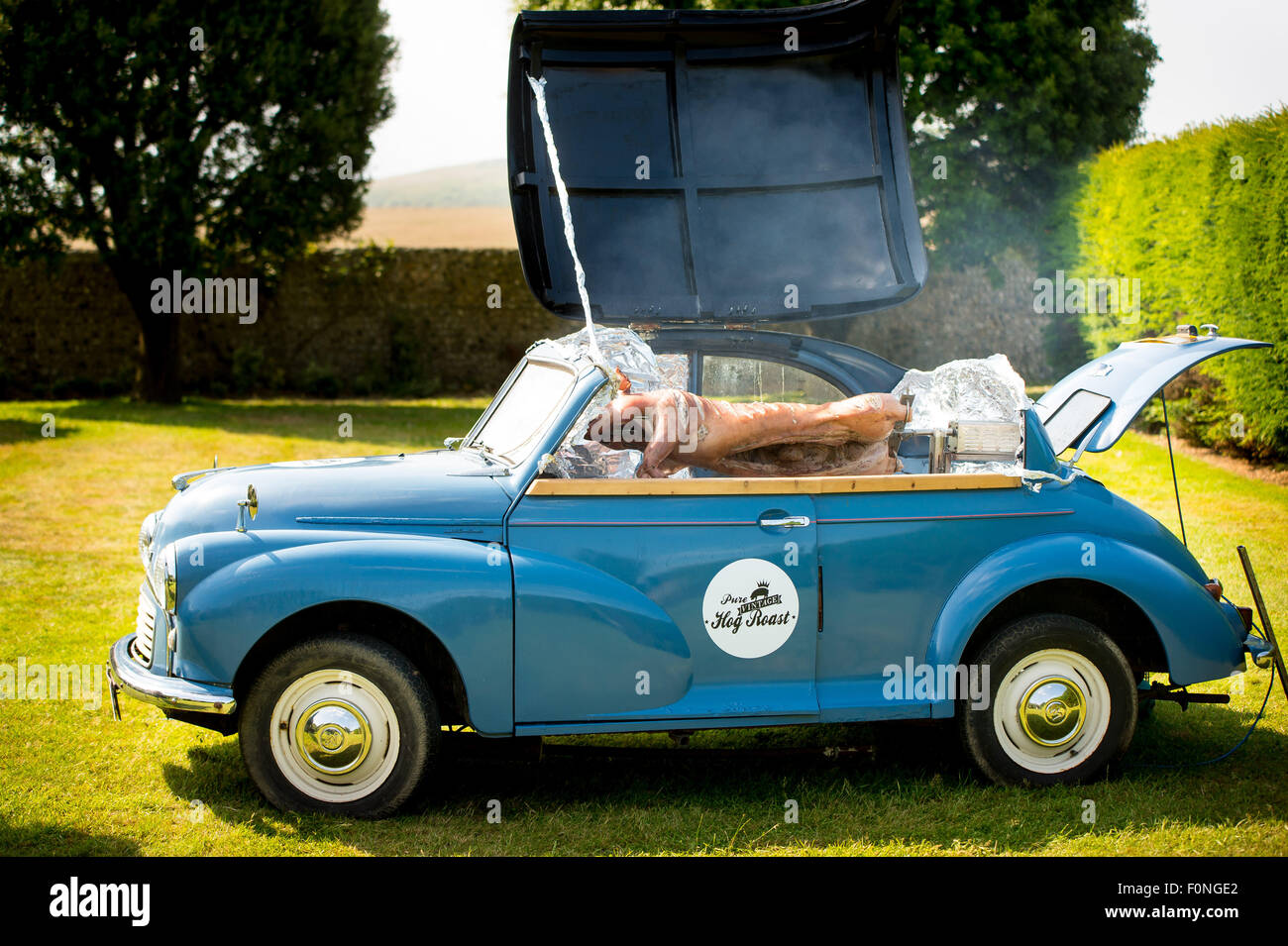 A 1955 Morris minor split screen car being used as a cooking station to ...
