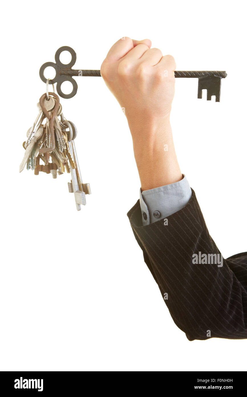Hand holding many keys Stock Photo - Alamy