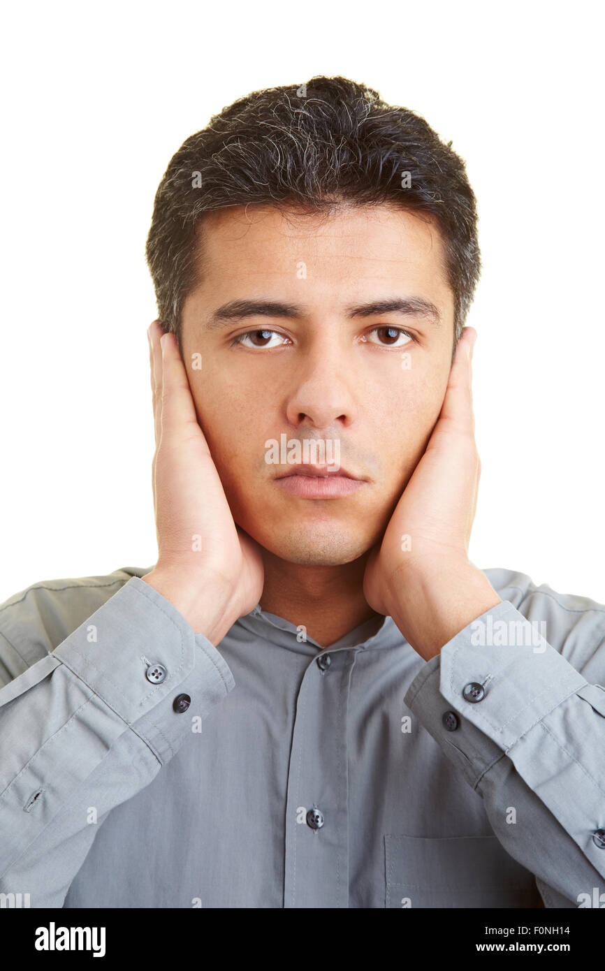 Man covering his ears with his hands Stock Photo - Alamy