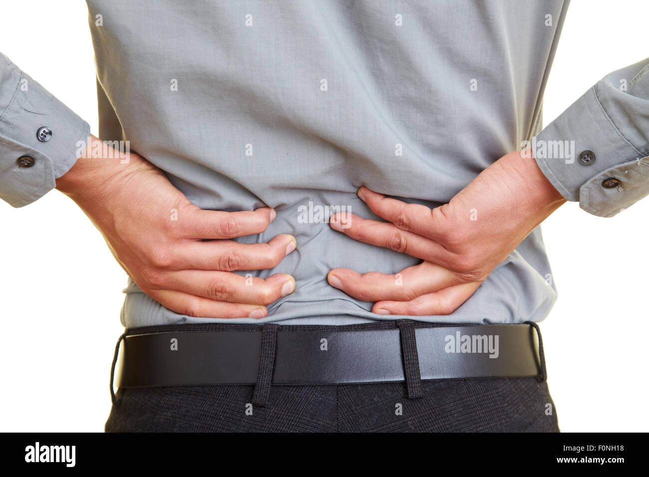Man standing with pain in his back Stock Photo - Alamy