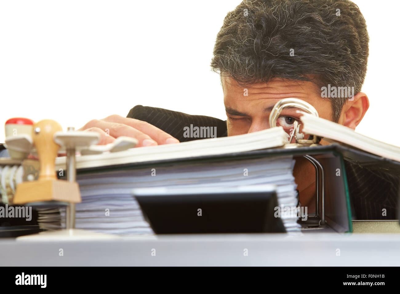 Businessman looking through files Stock Photo - Alamy