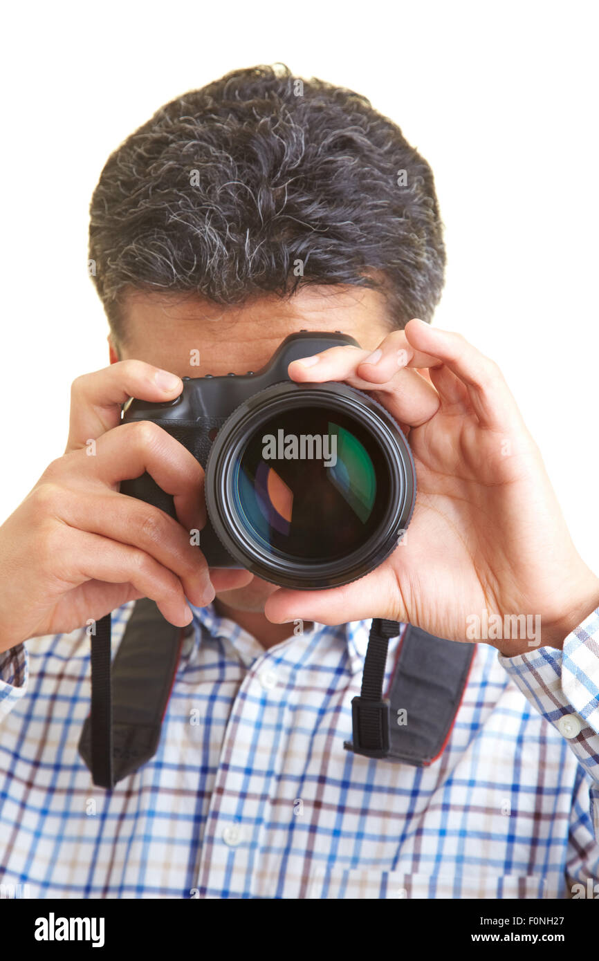 Man looking through the lens of a digital SLR camera Stock Photo - Alamy