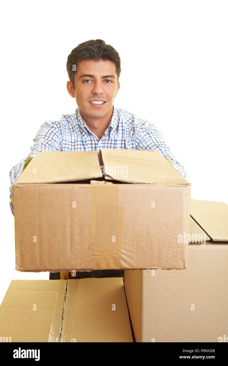 Man behind cardboard boxes holding a package Stock Photo - Alamy