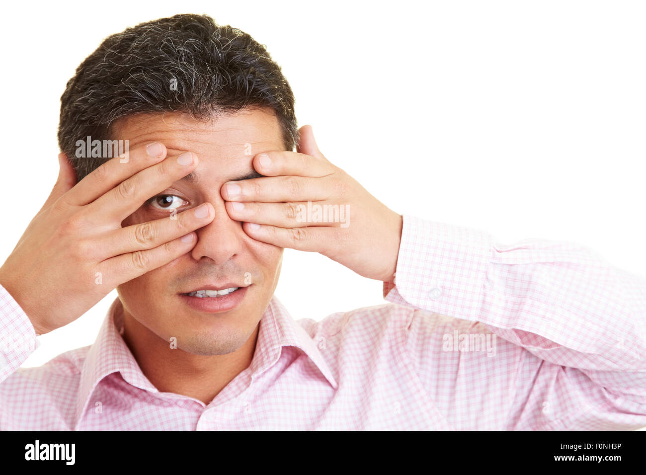 Hands peeking through fingers hi-res stock photography and images - Alamy