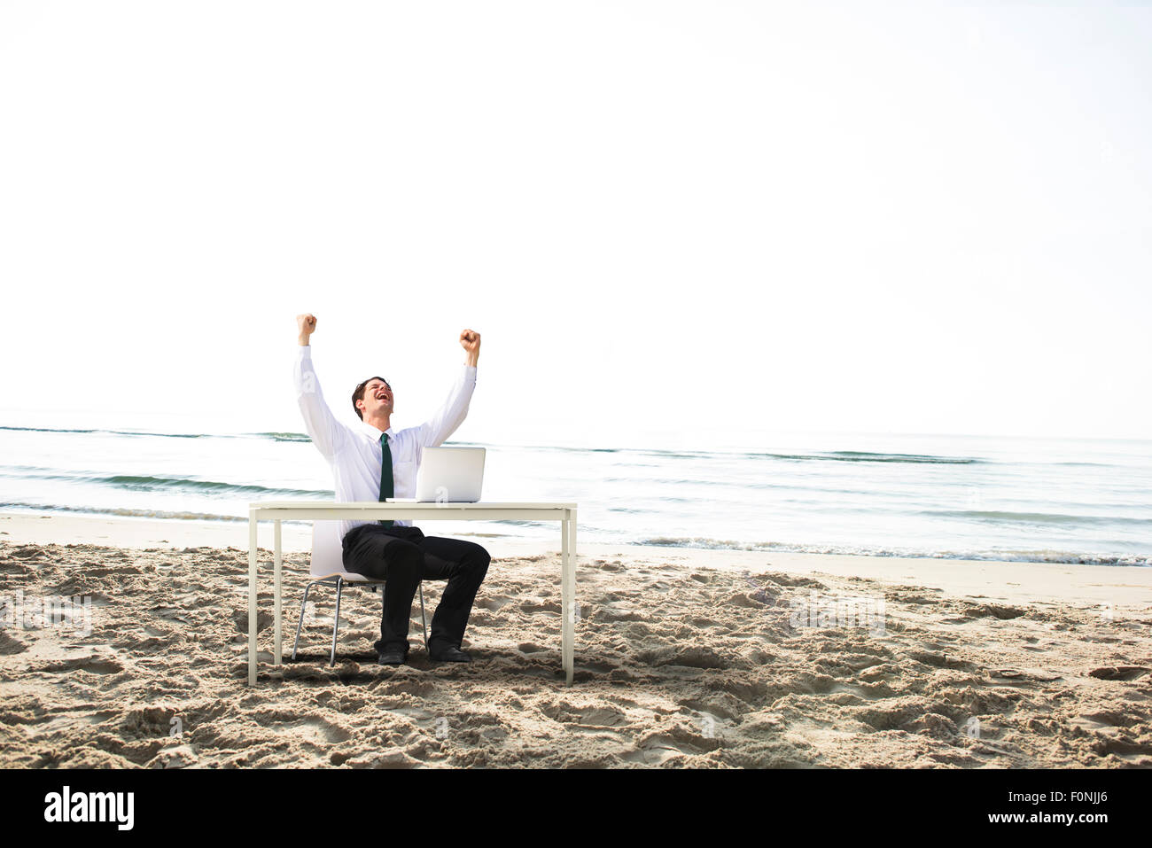 Businessman working success beach vacation hi-res stock photography and ...