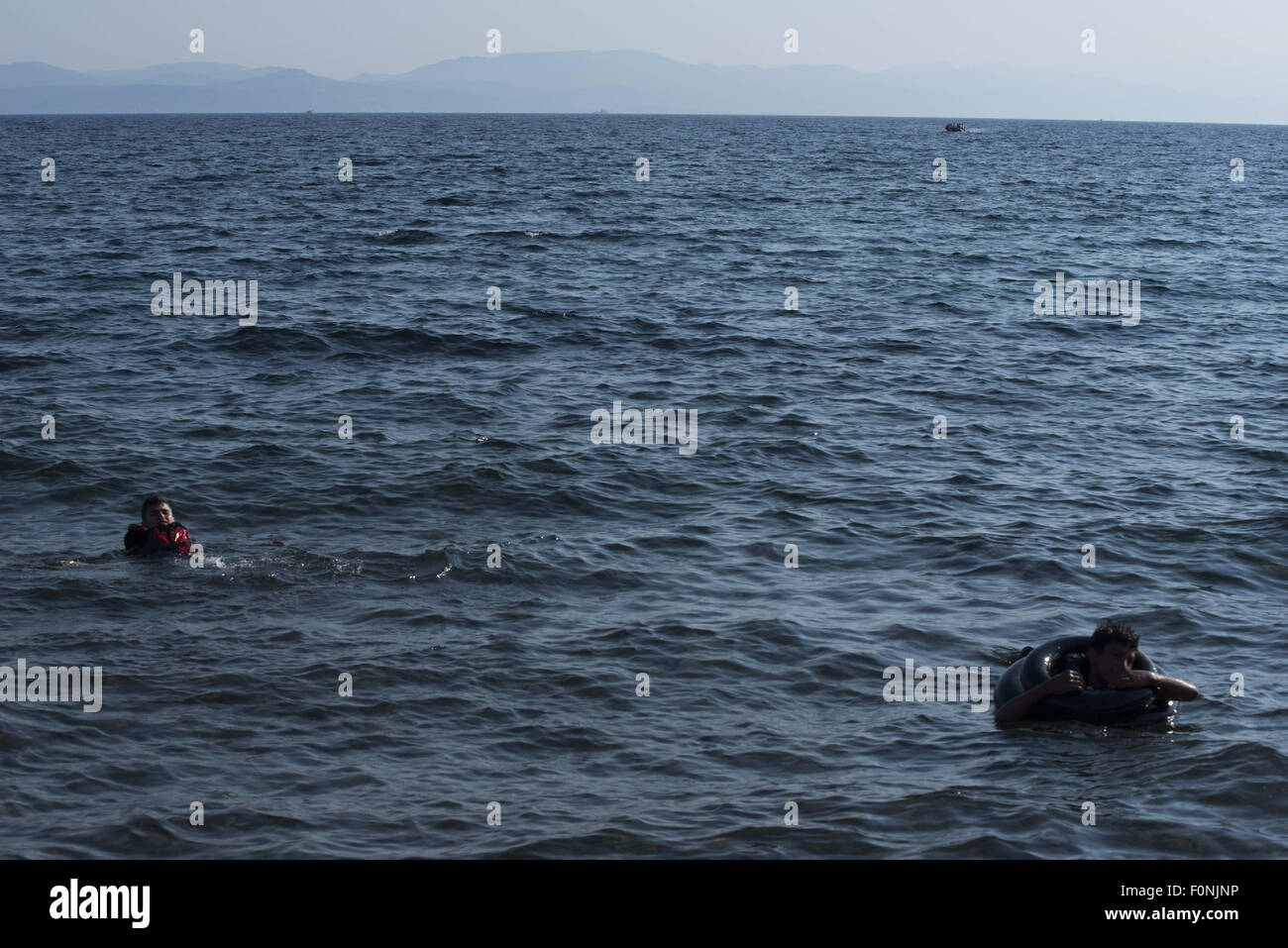 Lesbos, Greece. 19th Aug, 2015. Syrian refugees land on a beach on the ...