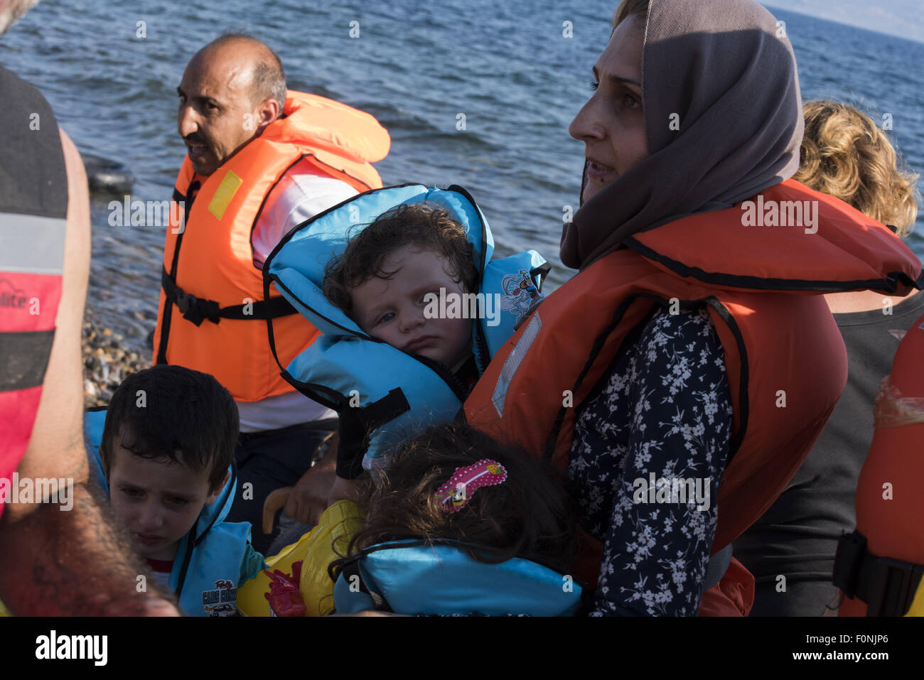 Lesbos, Greece. 19th Aug, 2015. Syrian refugees land on a beach on the ...