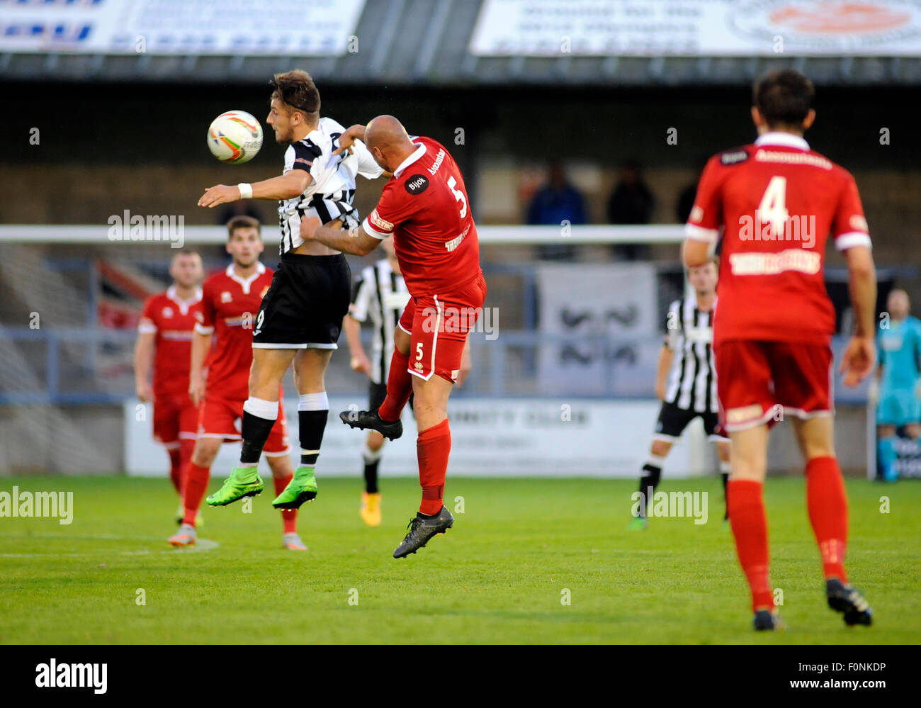 Dorchester, England. 18th August 2015. Tony Lee (DTFC) and Matt Oldring ...