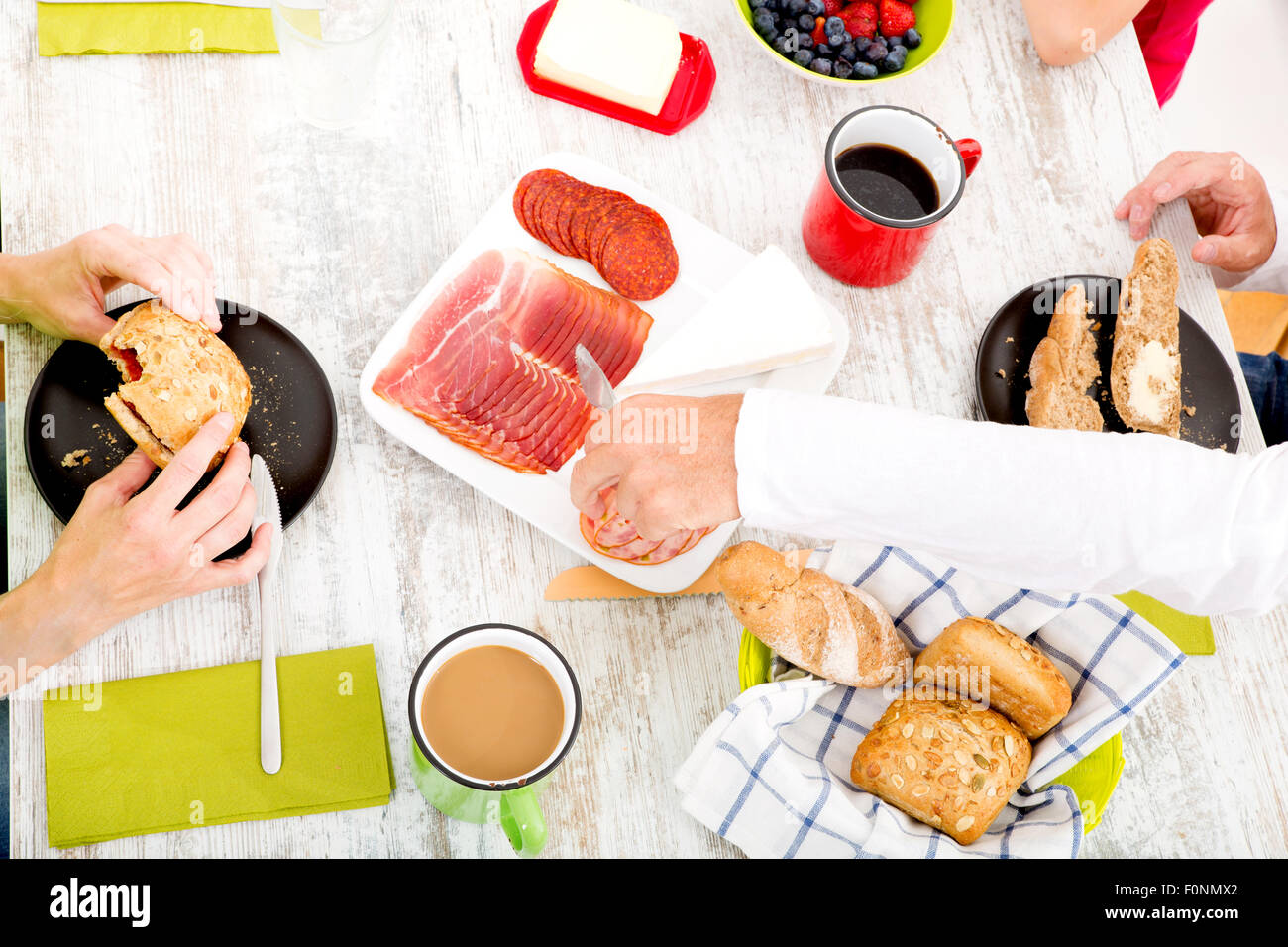 A family having breakfast at home seen from above Stock Photo - Alamy