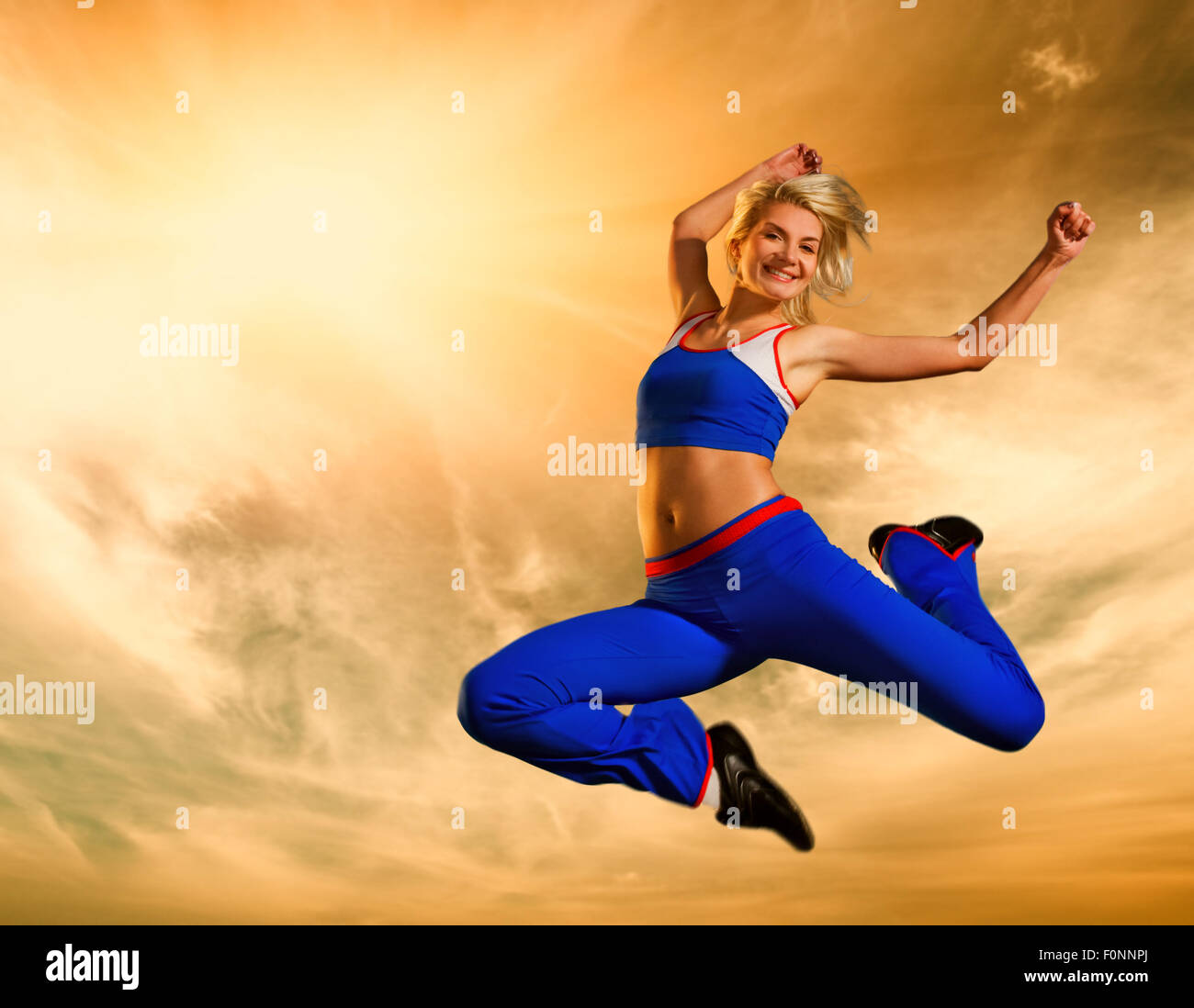 Beautiful woman jumping outdoors Stock Photo - Alamy