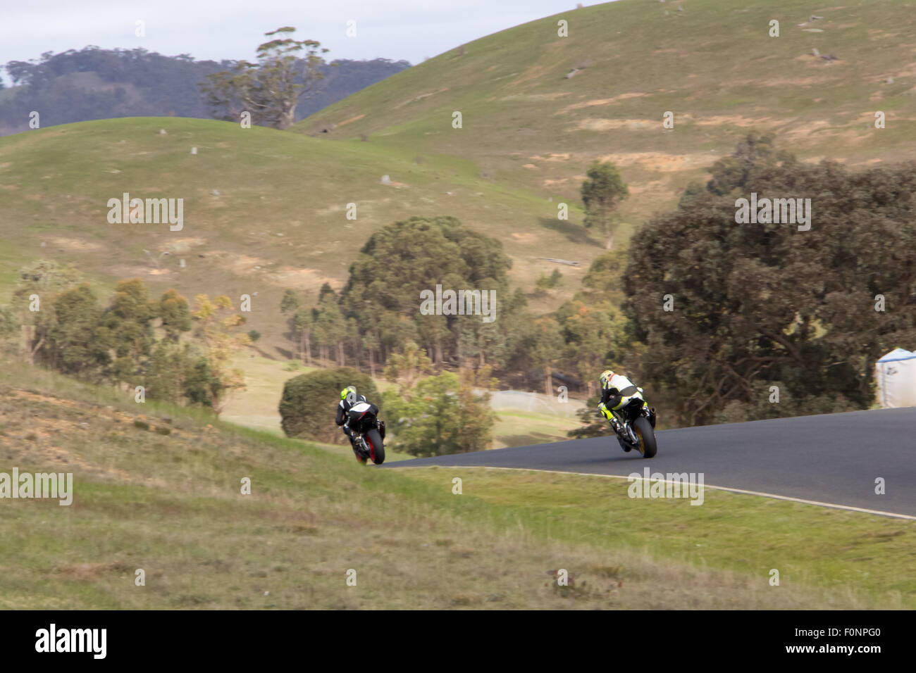 Two superbikes under full power exiting out of a corner Stock Photo - Alamy