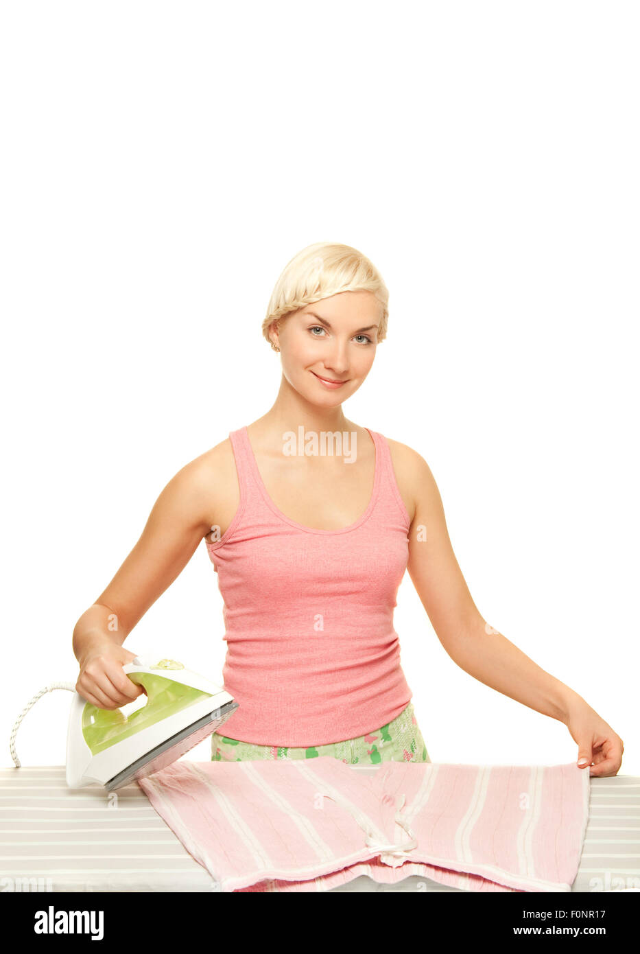 Beautiful woman ironing clothes. Isolated on white background Stock ...