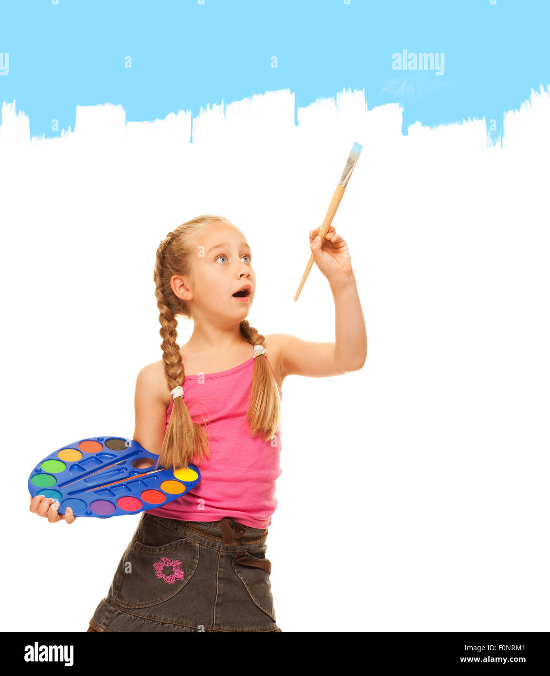 Beautiful little girl painting with blue paint Stock Photo - Alamy