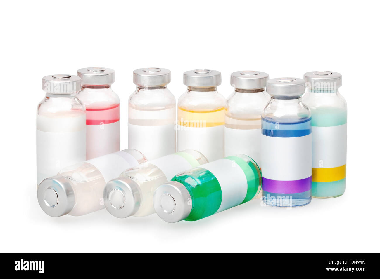 Group of the isolated vials with colored substances with clean labels ...