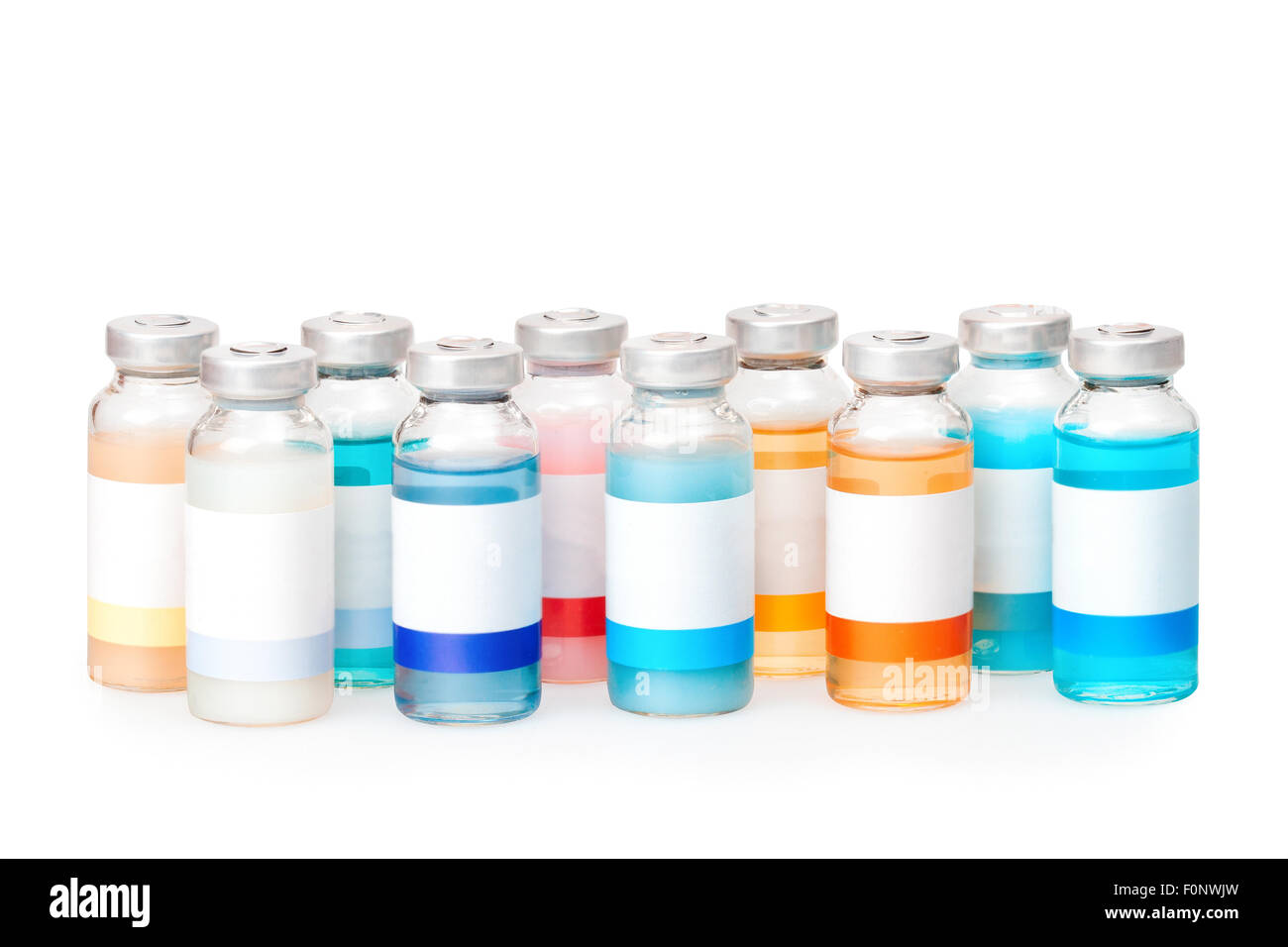 Group of the isolated vials with colored substances with clean labels ...