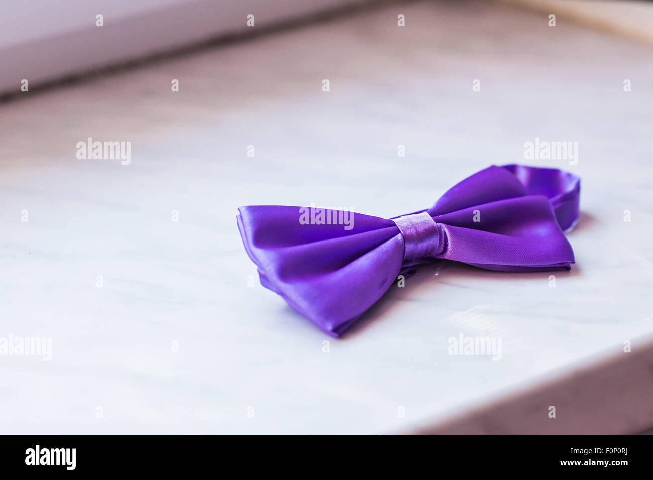 Purple bow close up Stock Photo - Alamy