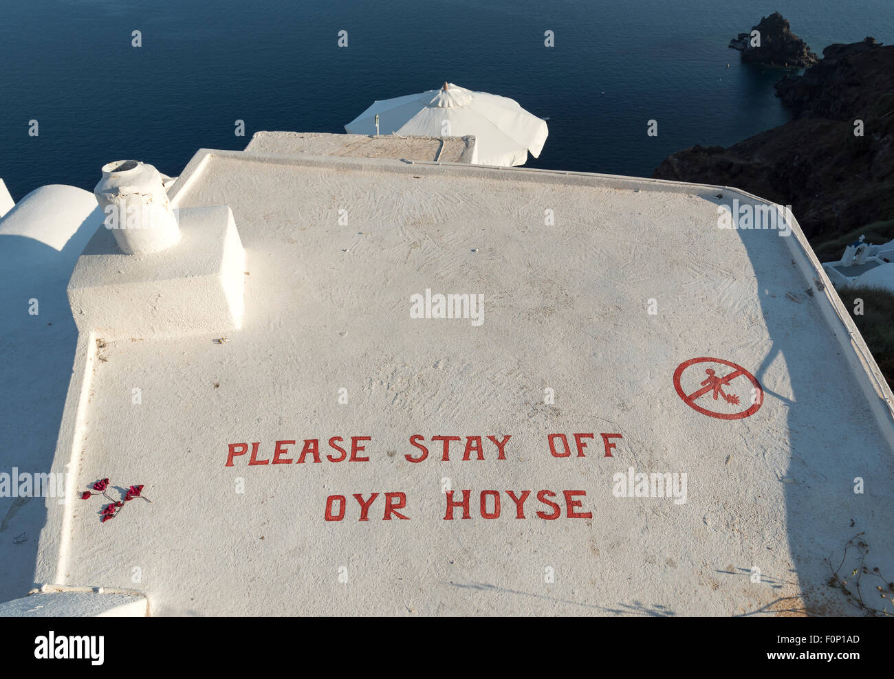 Rooftop Warning Sign for Tourists, Oia, Santorini, Greece Stock Photo ...