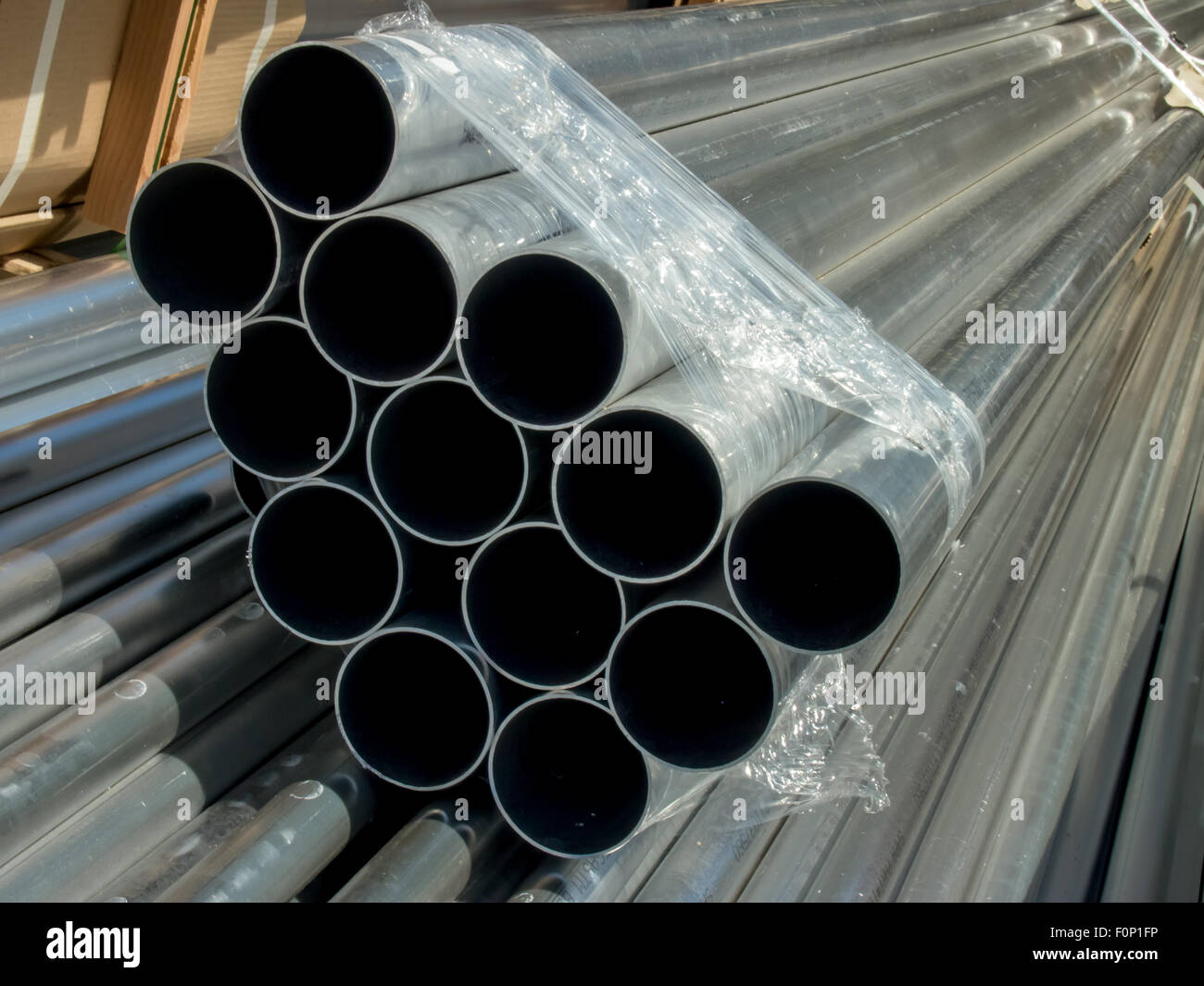 Stack of Many Pipes at the Construction Site Stock Photo - Alamy