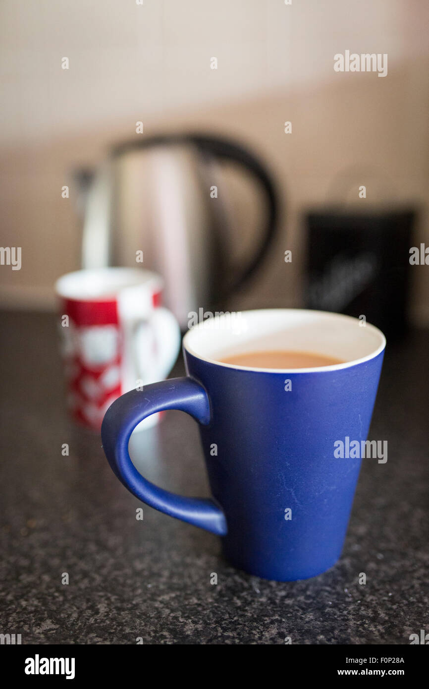 a kettle and a mug of tea and coffee Stock Photo - Alamy