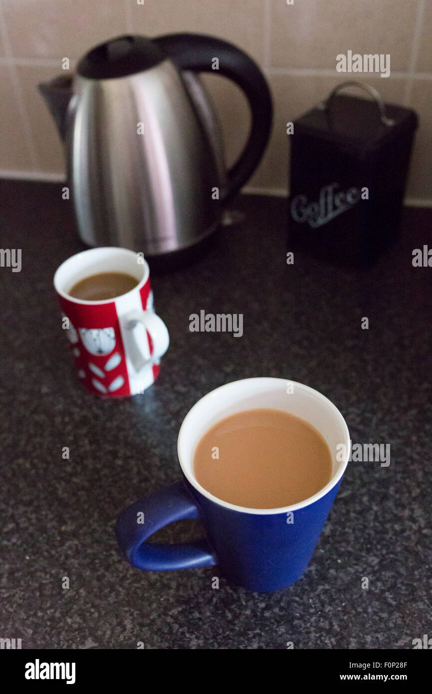a kettle and a mug of tea and coffee Stock Photo - Alamy