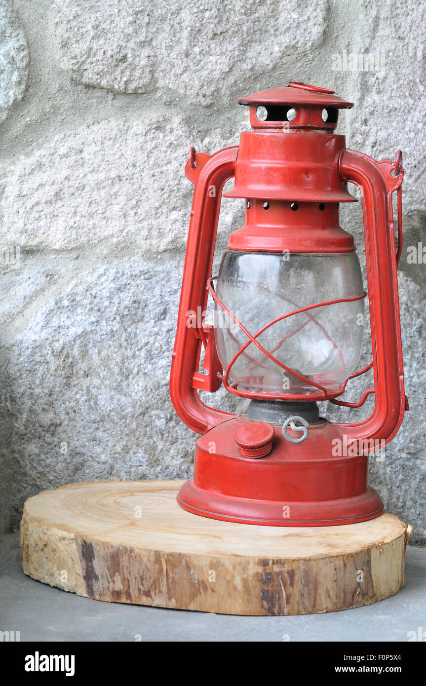Old red lantern against a stone wall Stock Photo - Alamy