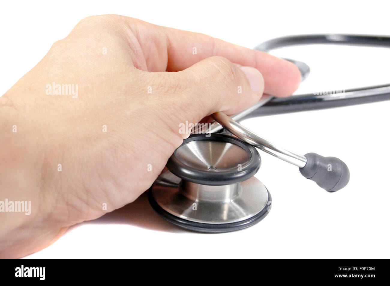 Doctor's hand holding a stethoscope isolated on white Stock Photo - Alamy