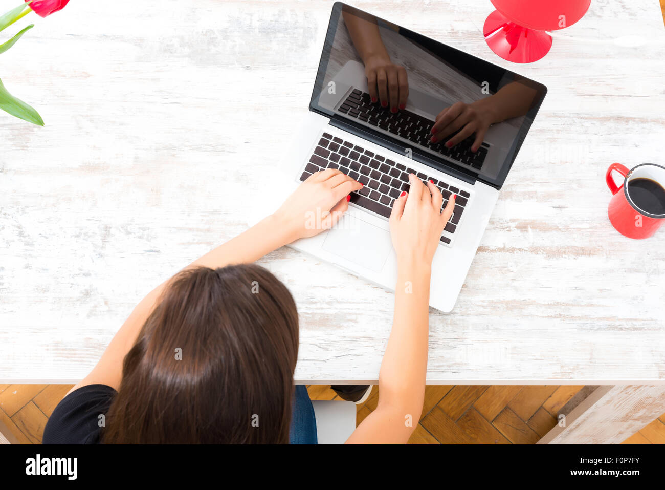 A young beautiful woman using a Laptop computer at home Stock Photo - Alamy