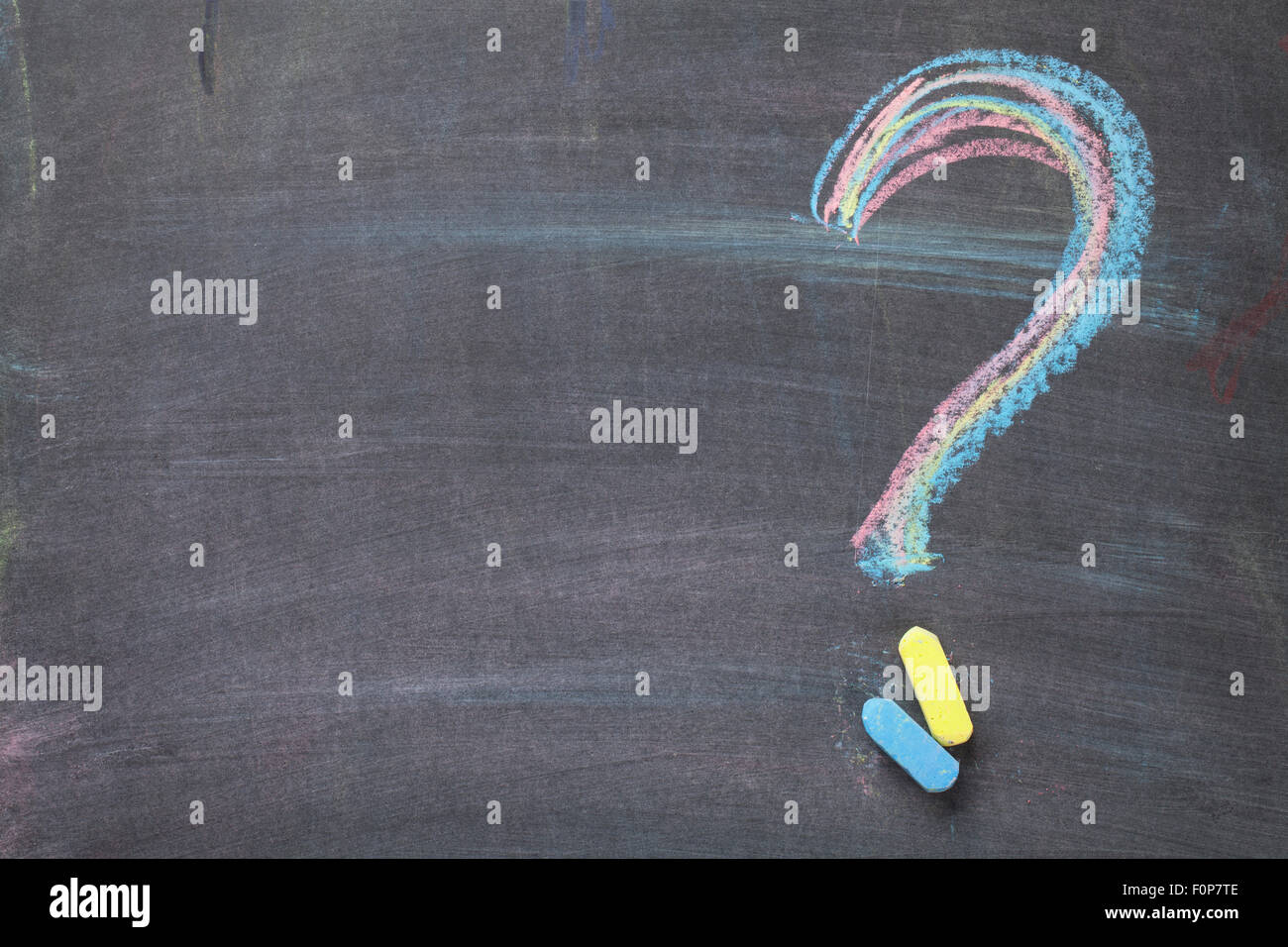 Colorful chalk question mark on blackboard background with copy space ...