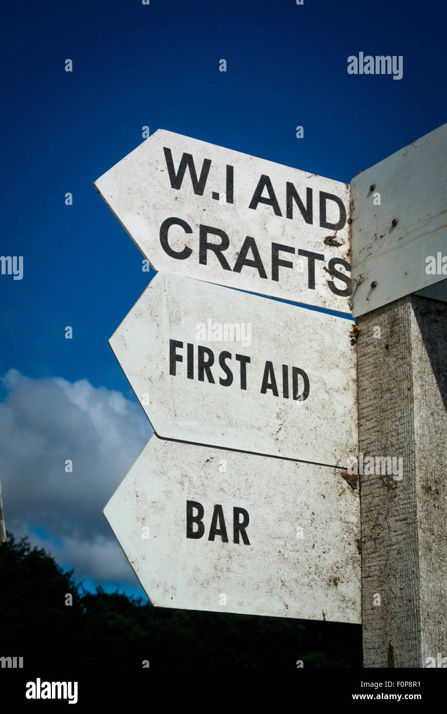 Signpost at local country show giving directions to WI and Crafts ...